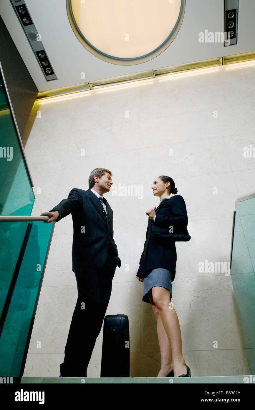 Office workers talking and low angle hi-res stock photography and ...