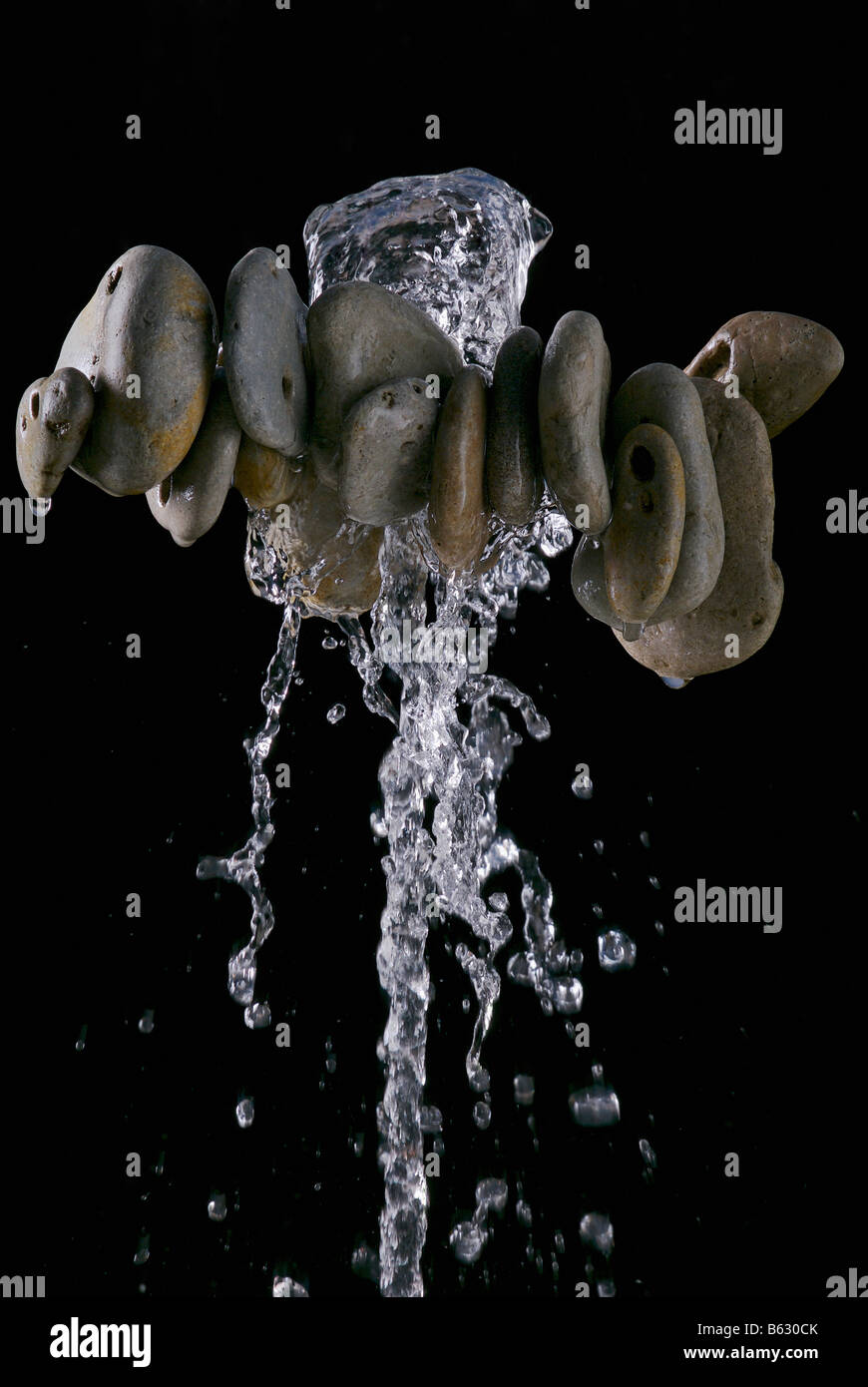 Water dripping from pebbles Stock Photo - Alamy