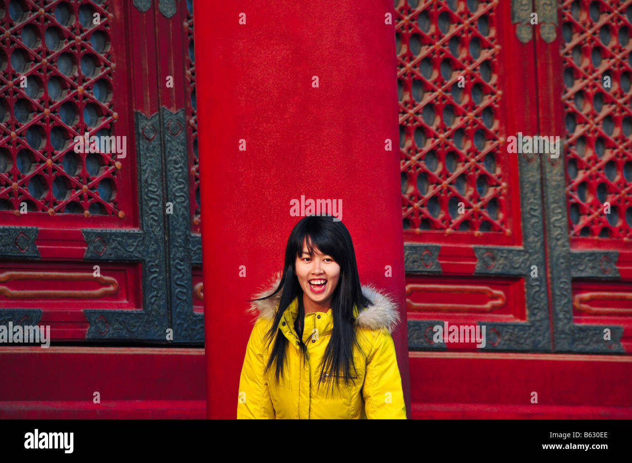 Chinese young woman in front of a temple in the Forbidden city Beijing ...