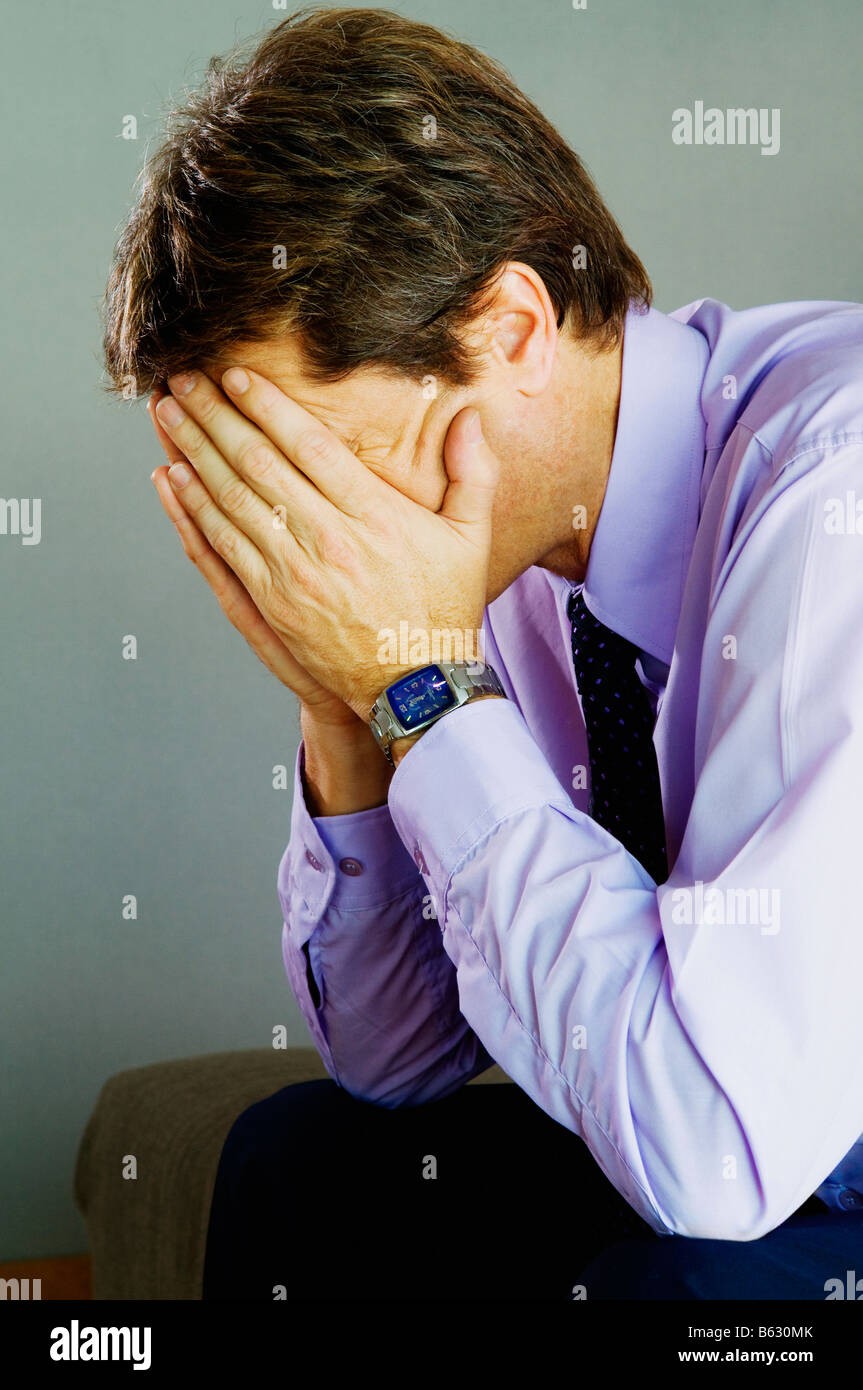 Man head in hands upset bed hi-res stock photography and images - Alamy