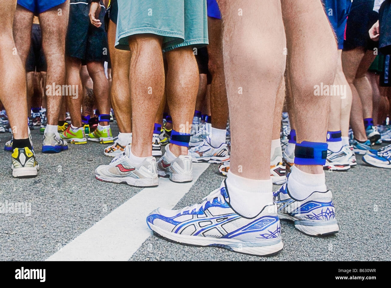 Low section view of a group of people standing in a marathon Stock ...