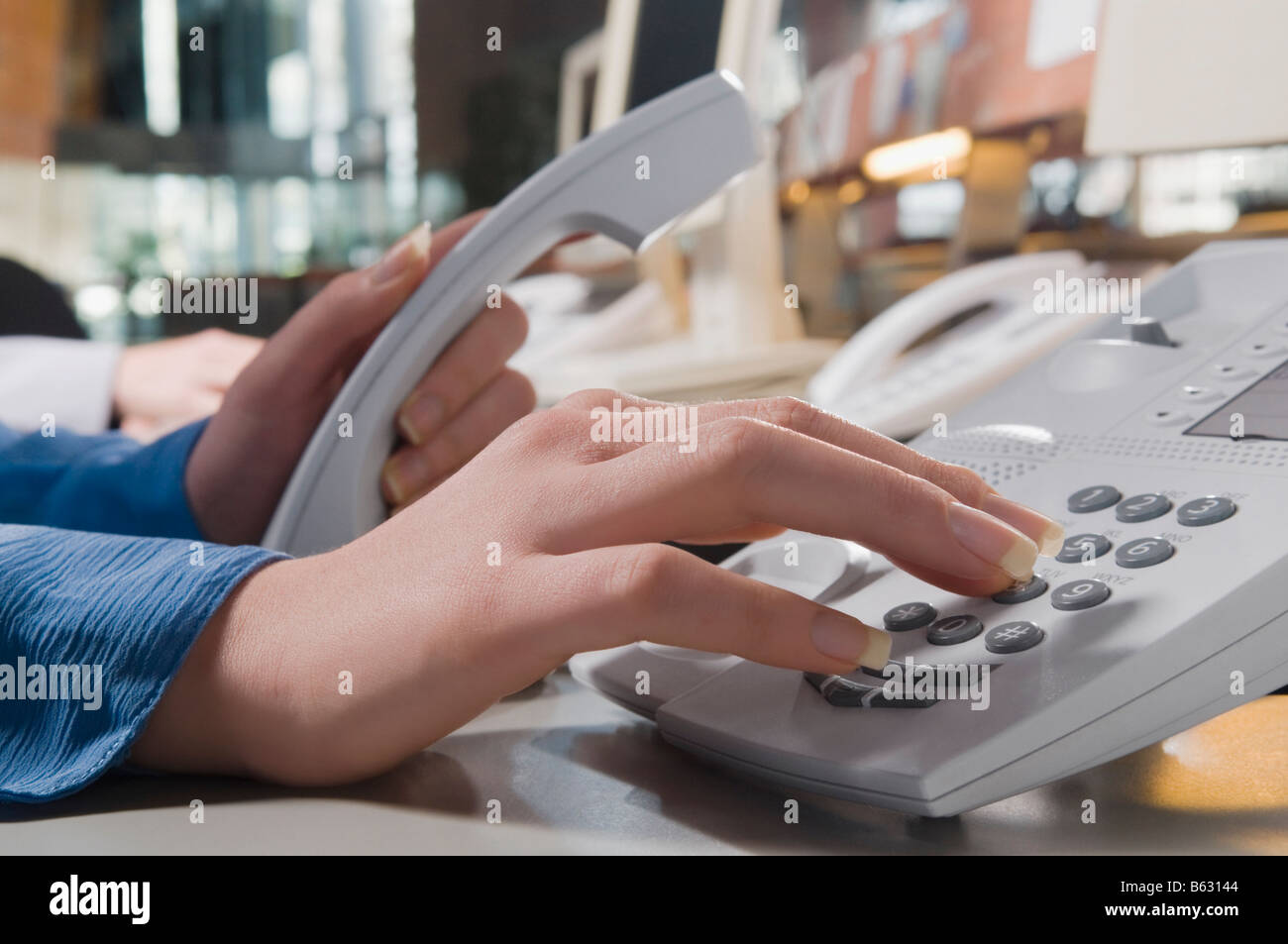 Unrecognizable office worker dialing landline hi-res stock photography ...
