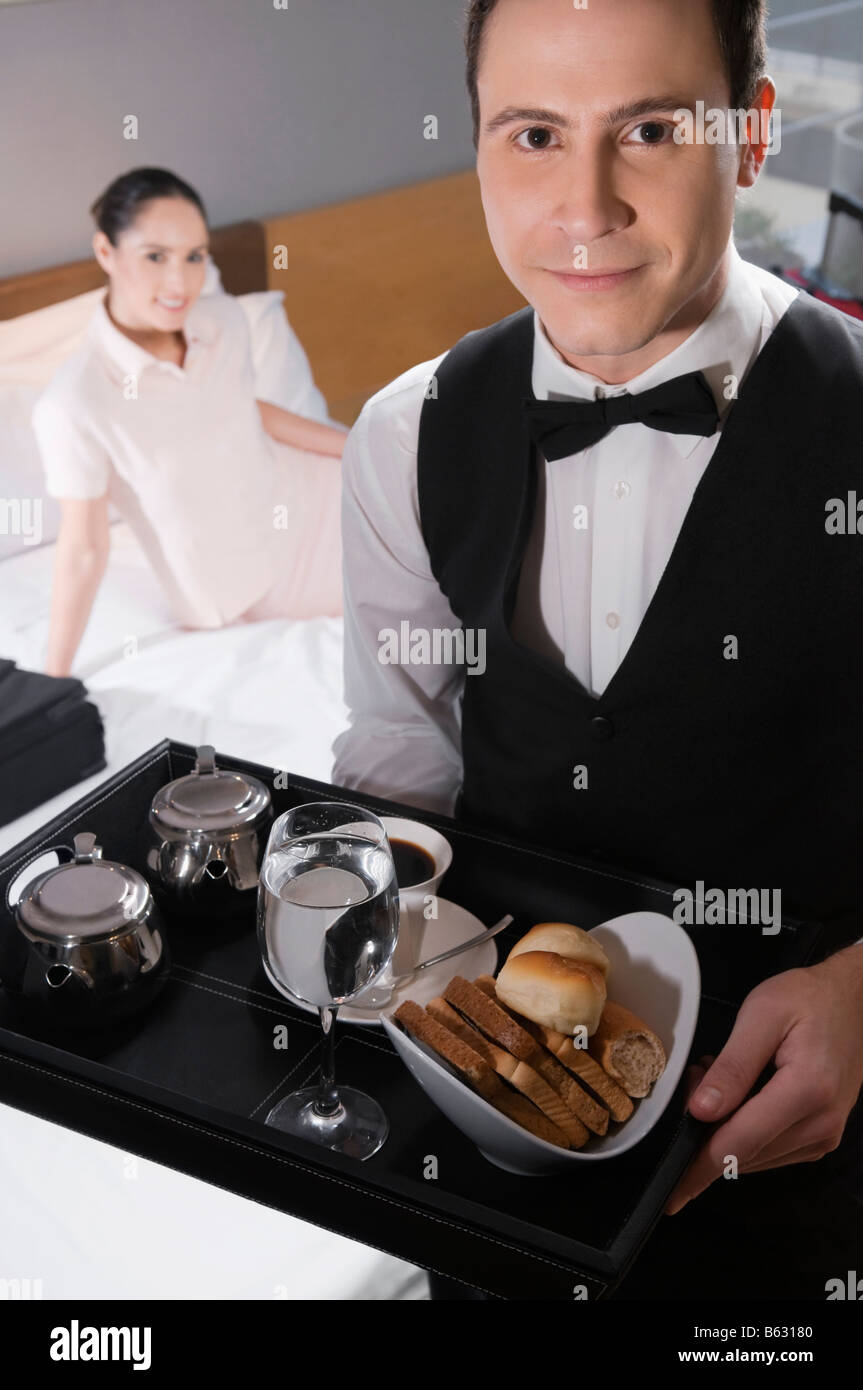 Hotel waiter carrying drinks hi-res stock photography and images - Alamy
