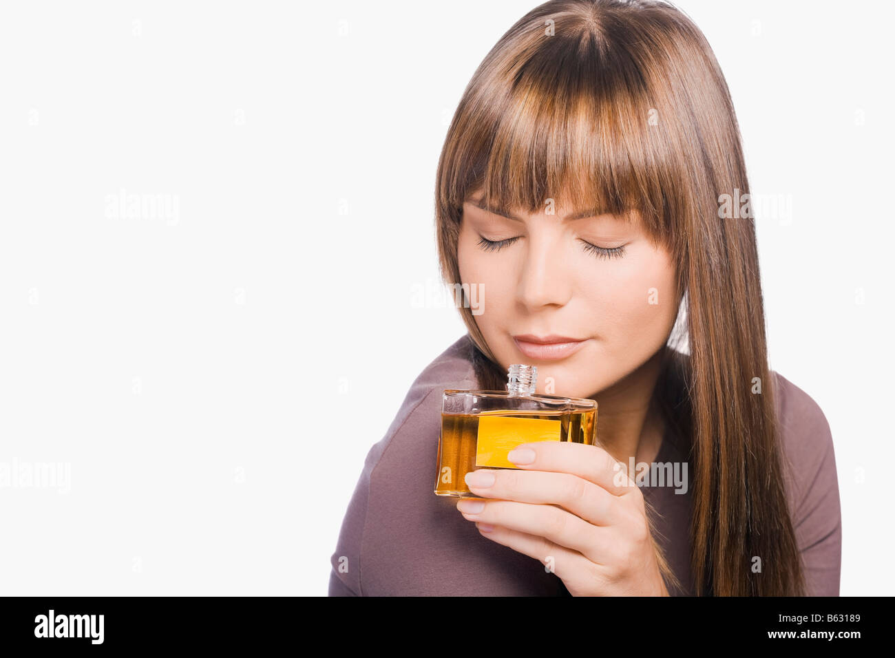 Woman sniff perfume hi-res stock photography and images - Alamy