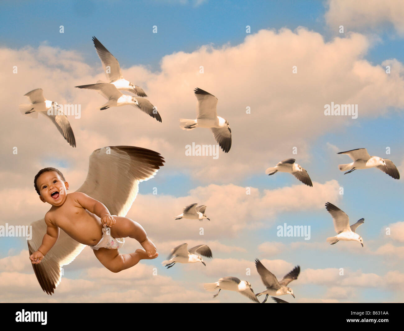 Low angle view of a baby boy flying Stock Photo - Alamy