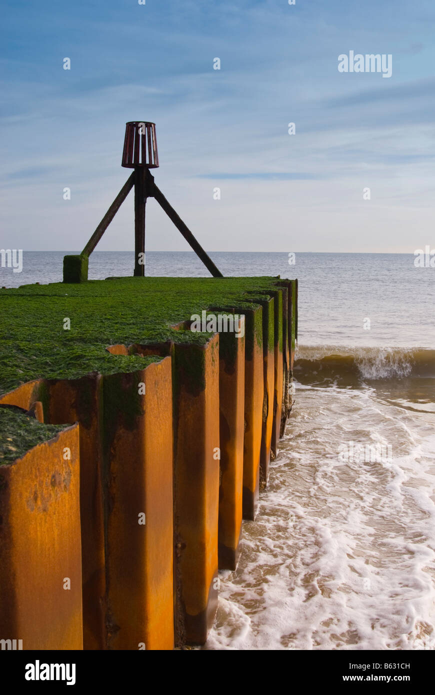 Beach marker marking post on groyne on a uk beach Stock Photo - Alamy
