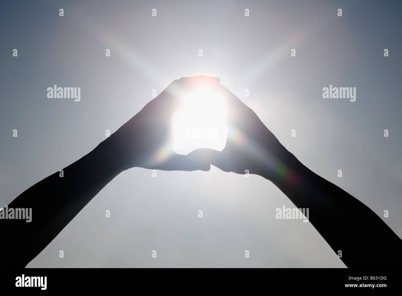 Sunlight shining through a finger frame Stock Photo - Alamy