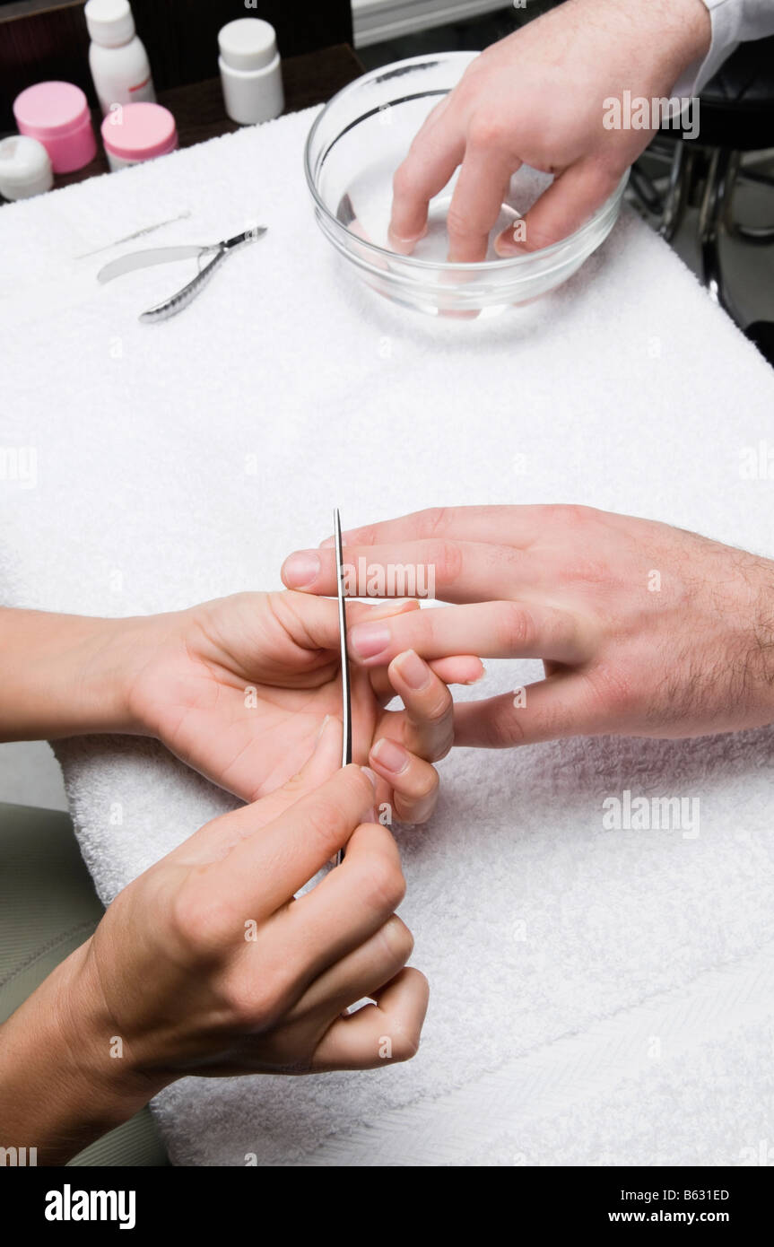 Close-up of a man's hand getting manicure Stock Photo - Alamy