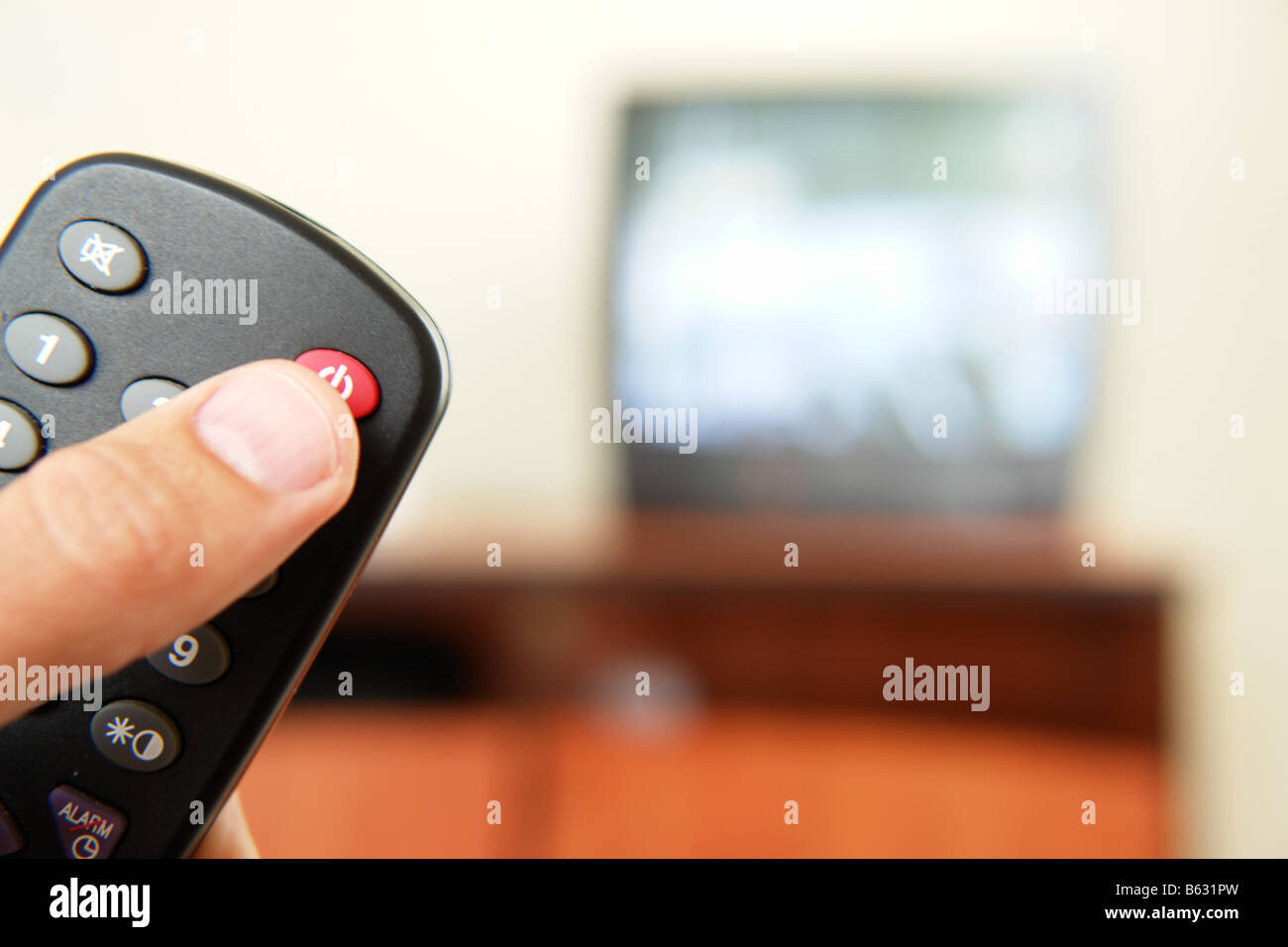 Television screen with tv remote control in foreground Stock Photo - Alamy