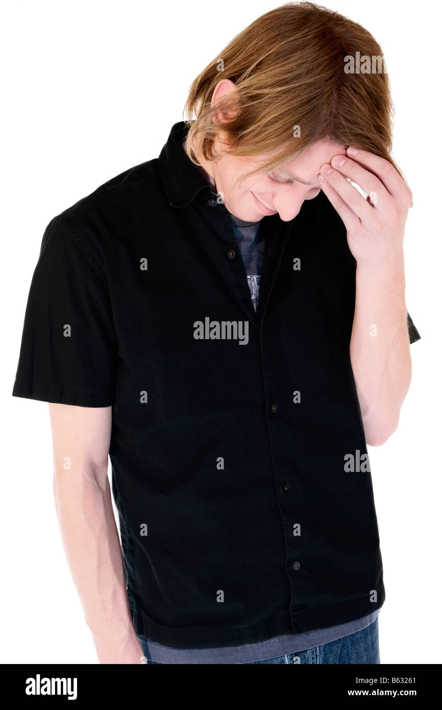 Close-up of a young man looking shy and smiling Stock Photo - Alamy