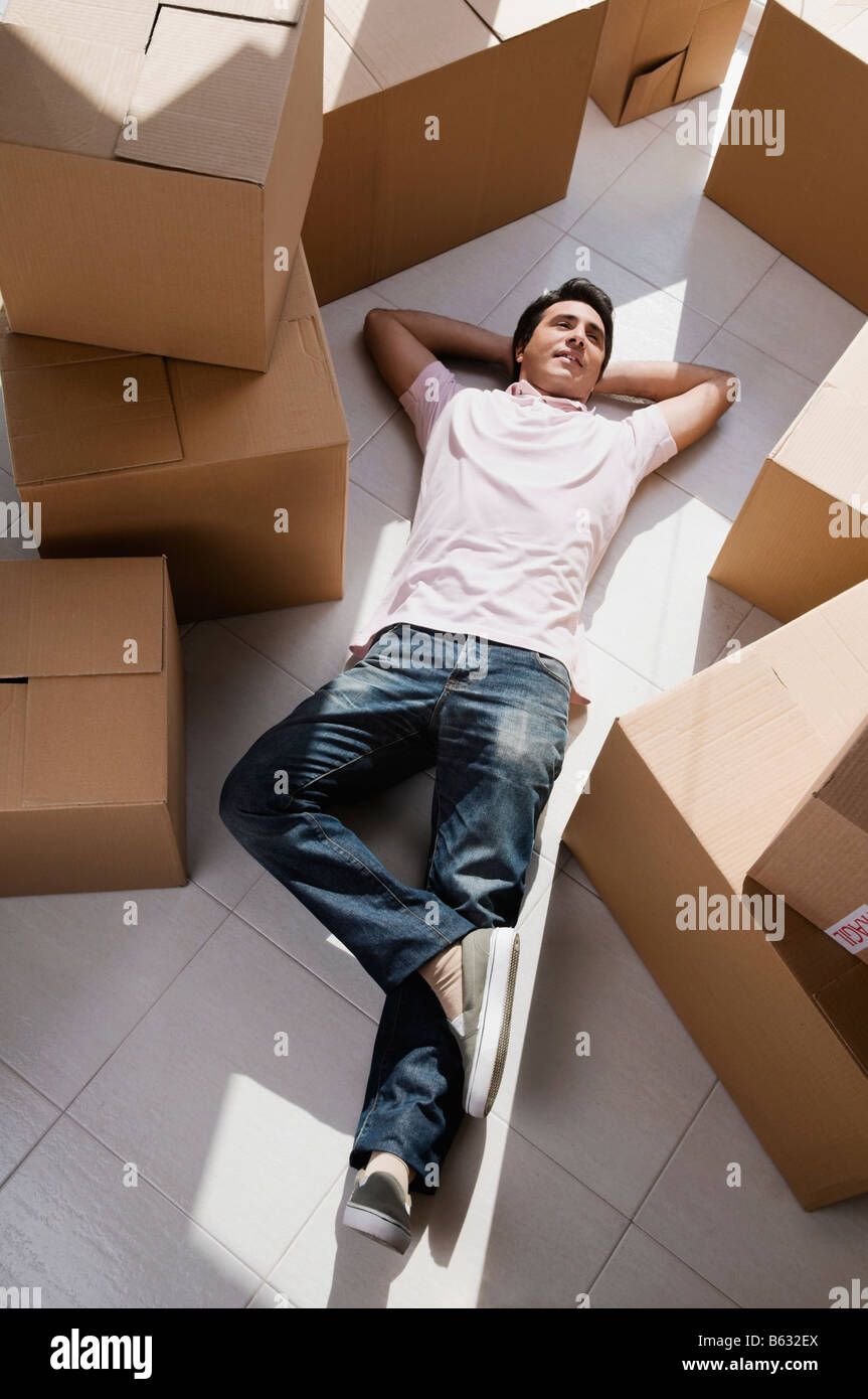 High angle view of a mid adult man lying on the floor Stock Photo - Alamy
