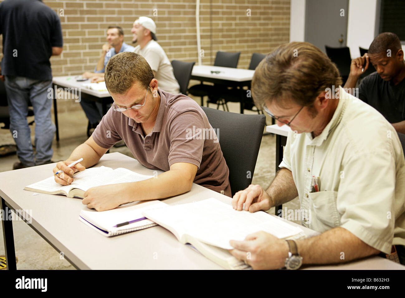 An adult education class doing research at their desks Stock Photo - Alamy