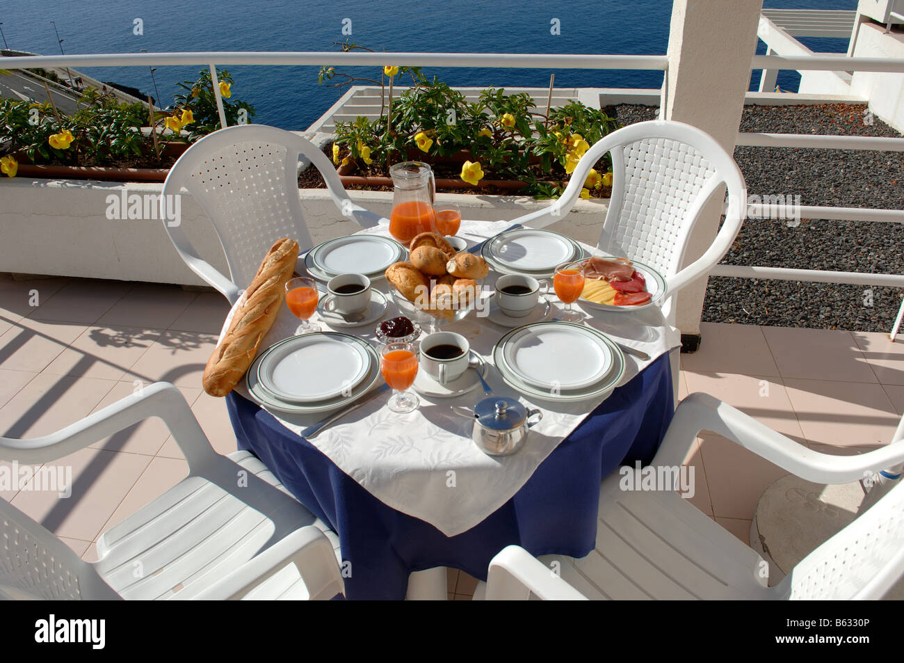 Breakfast table in sunshine Stock Photo - Alamy