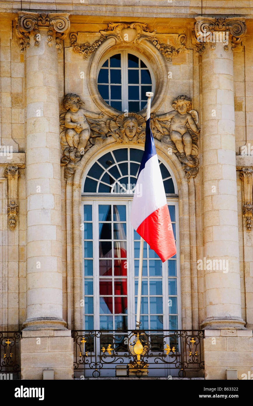 French flag in front of a government building, Place de la Bourse ...