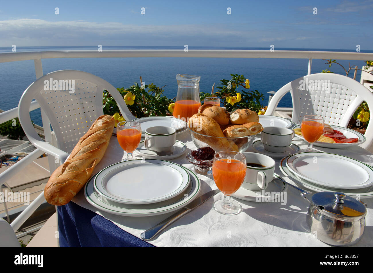 Breakfast table in sunshine Stock Photo - Alamy