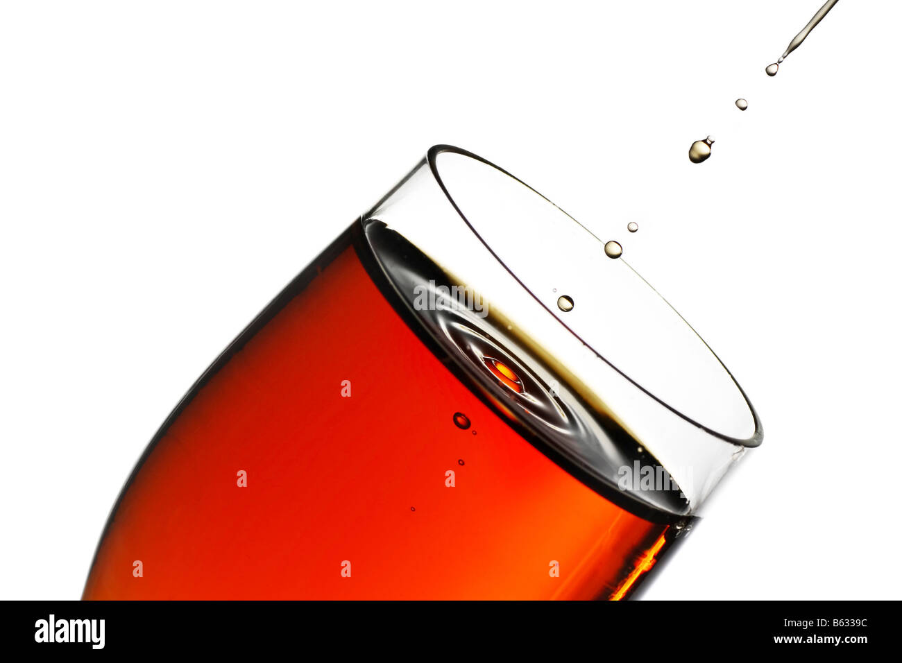 glass of sherry with a splash and drips Stock Photo - Alamy