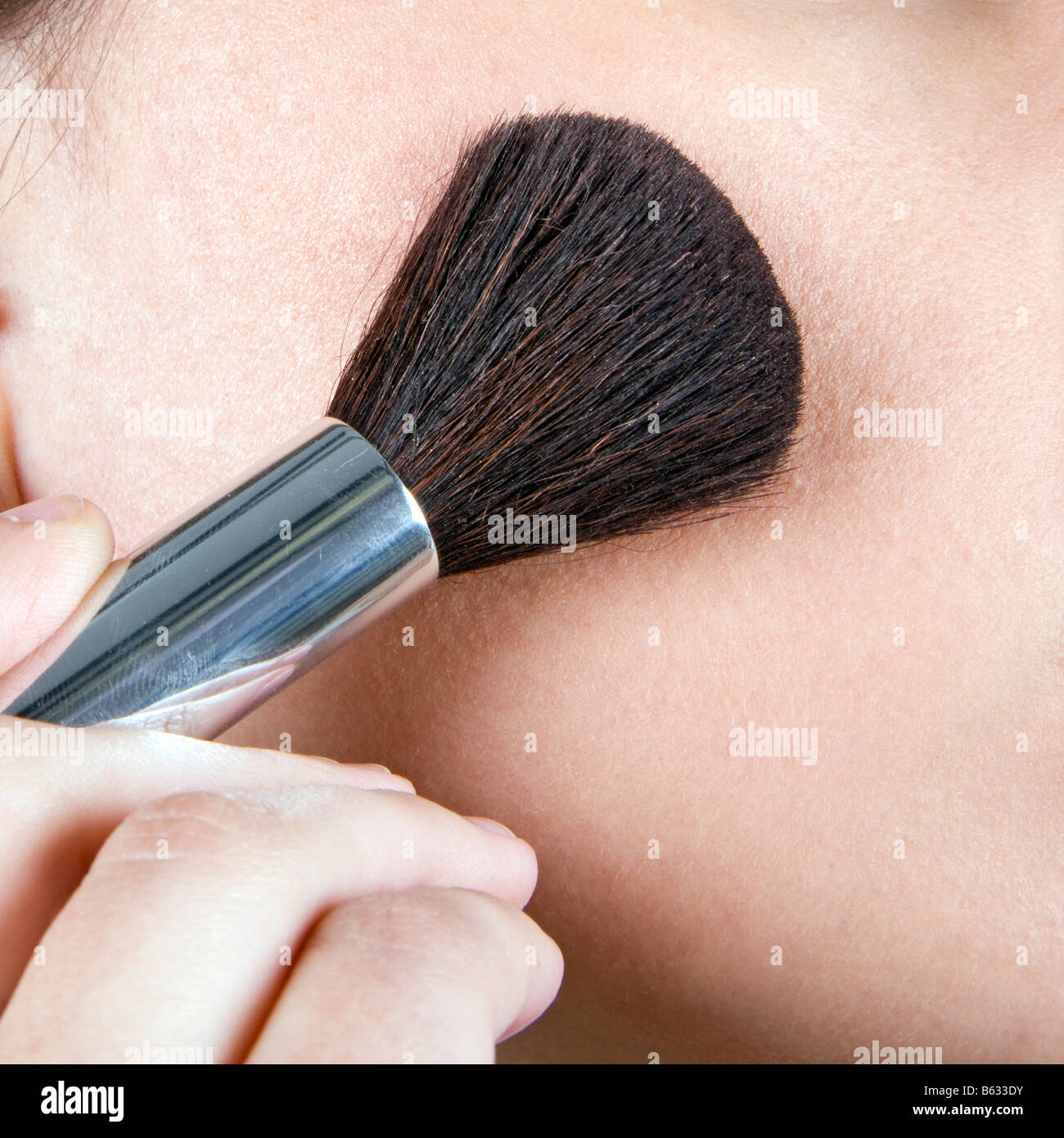 Closeup of woman applying makeup Stock Photo - Alamy