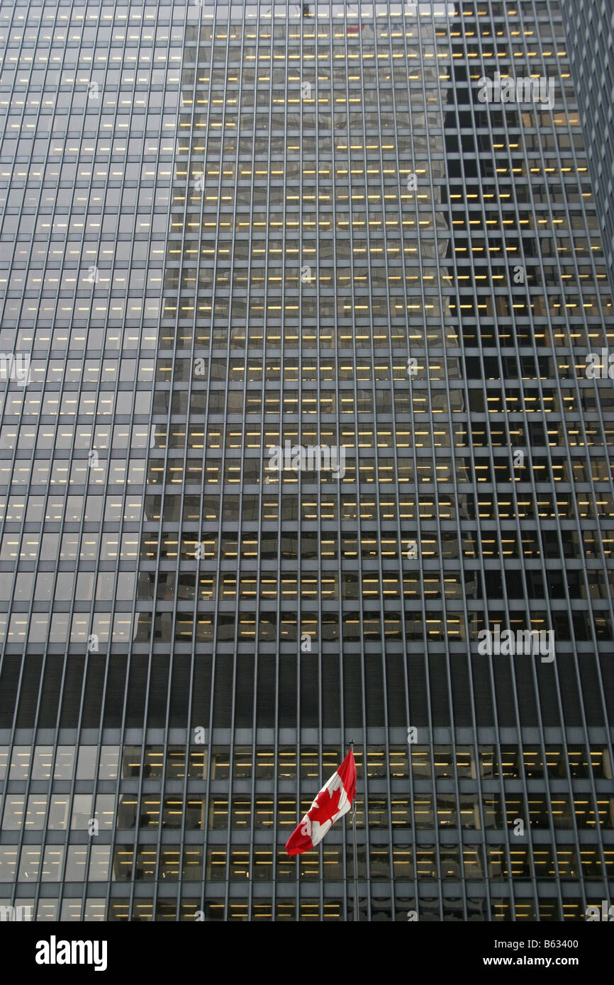 canadian flag waving against dark skyscraper windows Stock Photo - Alamy