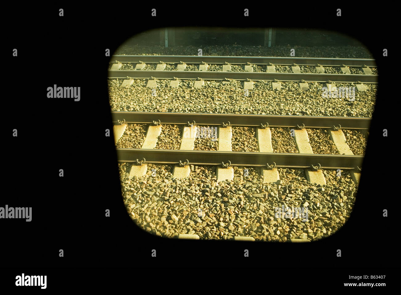 Railroad track viewed through a train window Stock Photo - Alamy