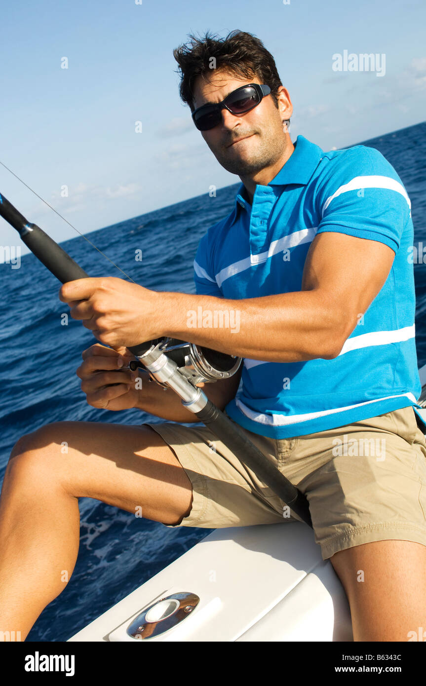 Black man fishing boat hi-res stock photography and images - Alamy