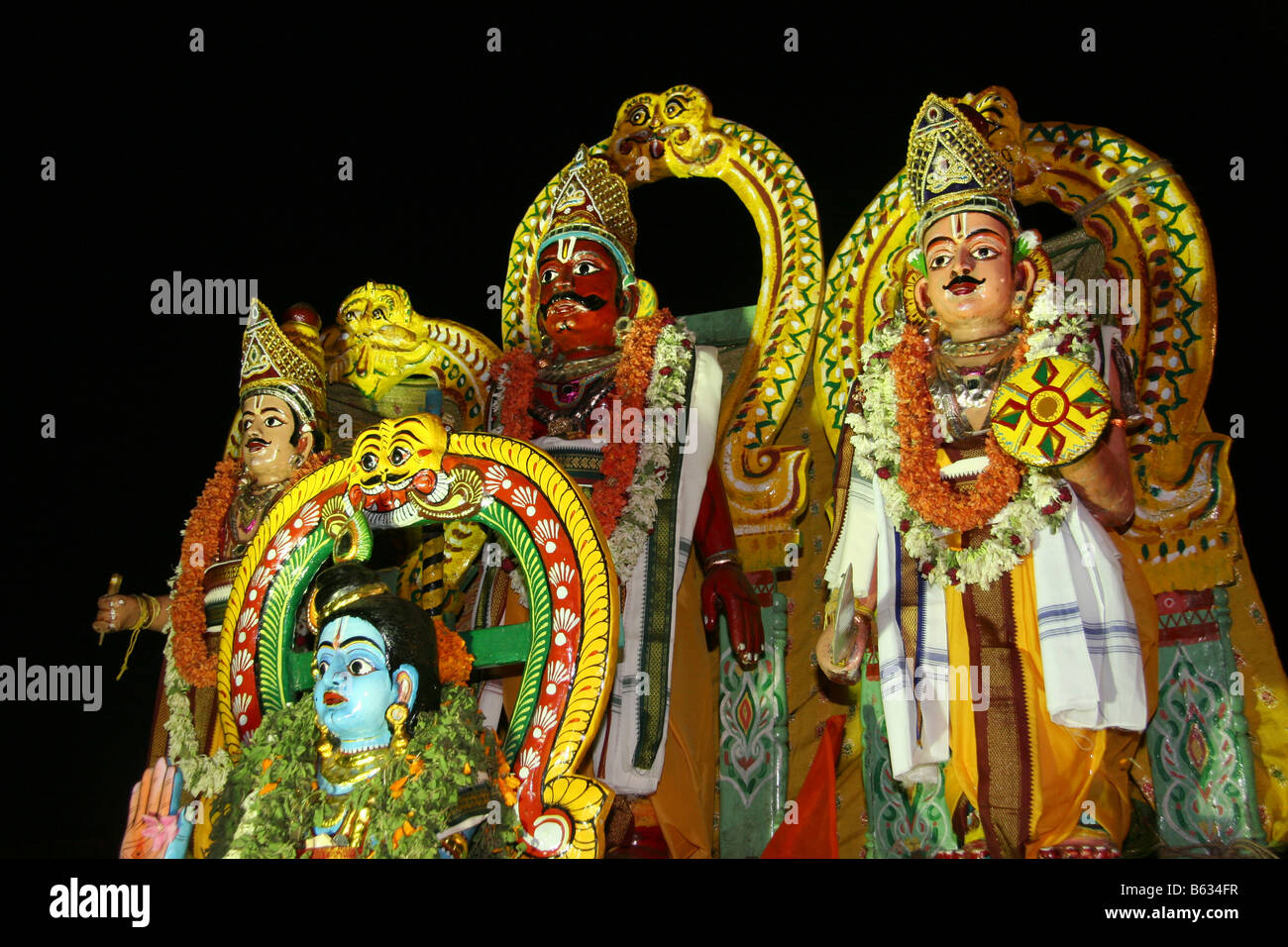 Hindu Deities are displayed during a firewalking festival in Bangalore ...