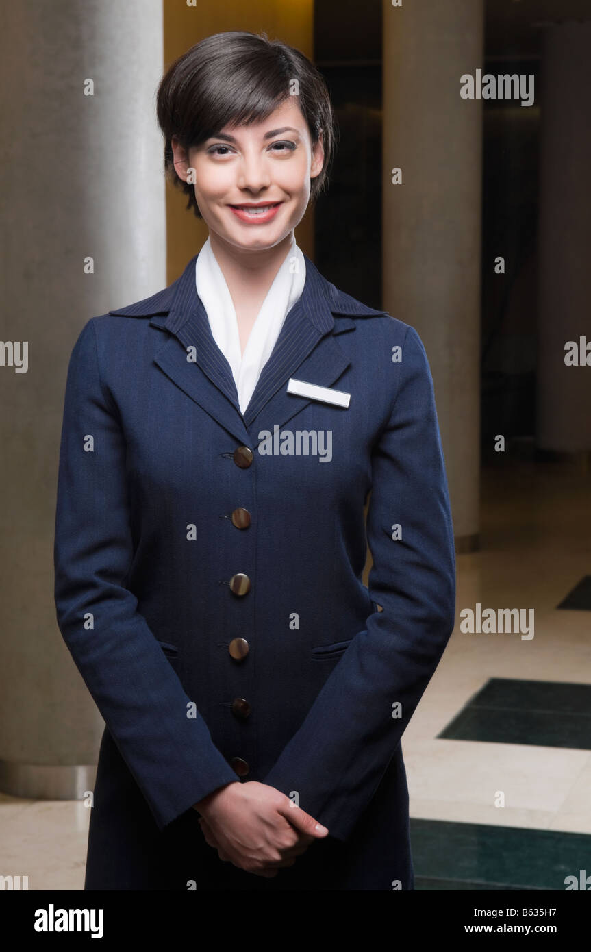 Portrait of a receptionist smiling Stock Photo - Alamy