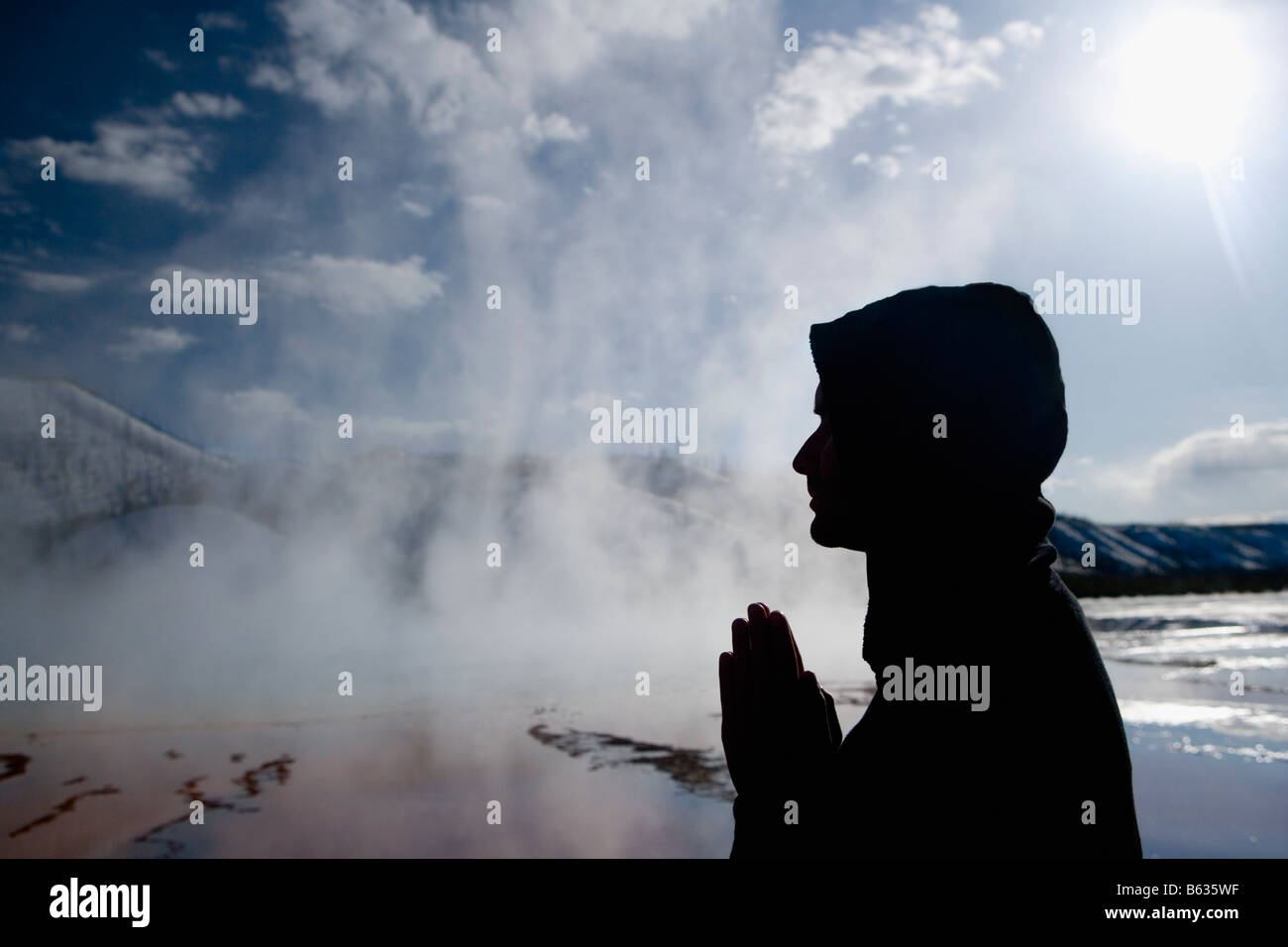 Silhouette of a man in a prayer position near a hot spring, Grand ...