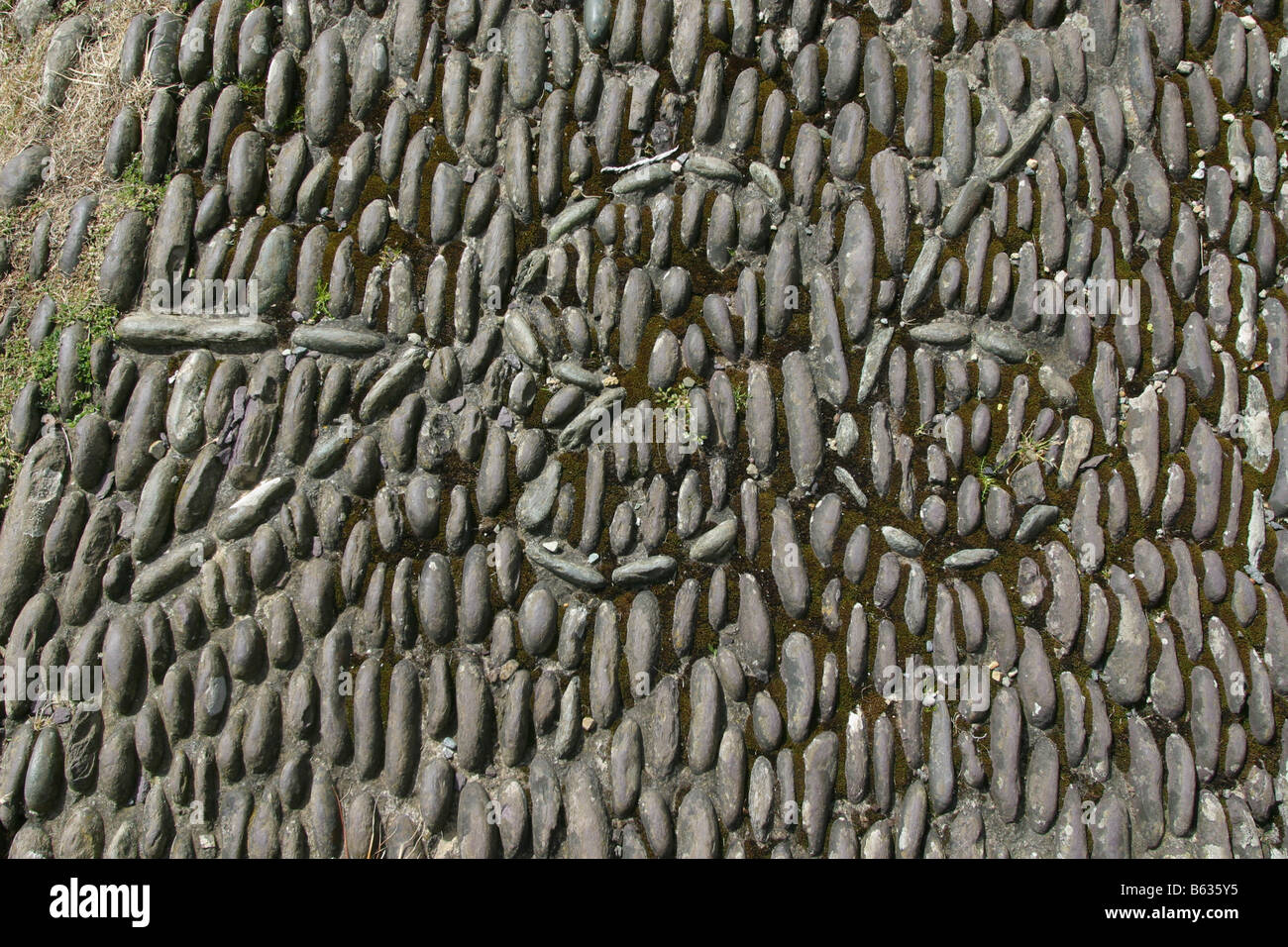 Pebble Pavings with date 786, St Non's Chapel with Blue sky.St Davids ...