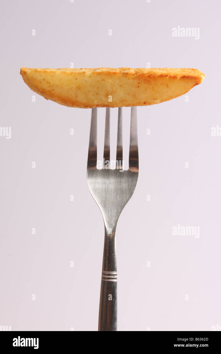 A chip on a fork Stock Photo - Alamy