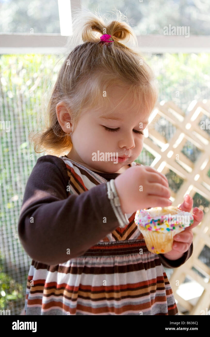 Messy child eating cupcake hi-res stock photography and images - Alamy