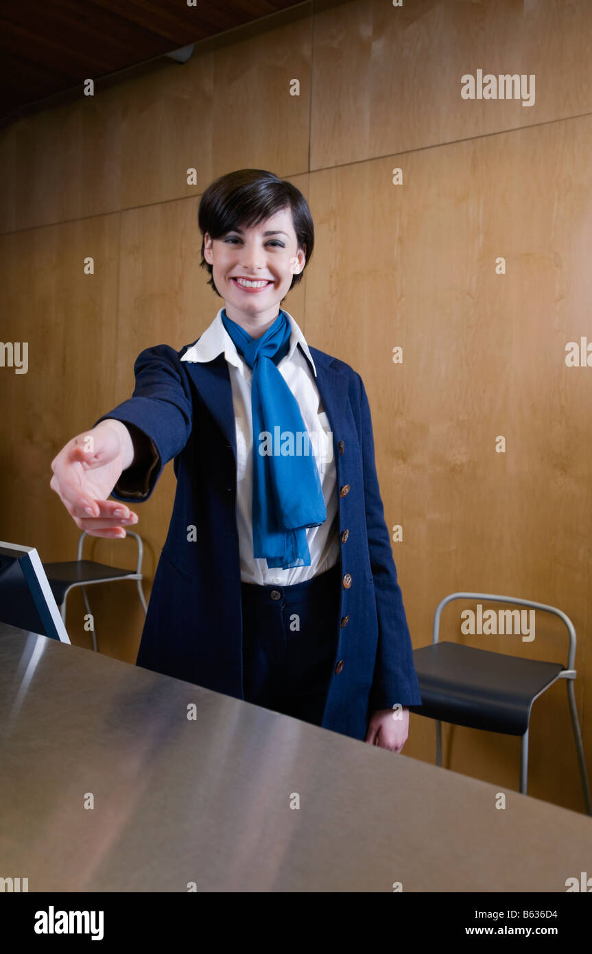 Young female receptionist in formal hi-res stock photography and images ...