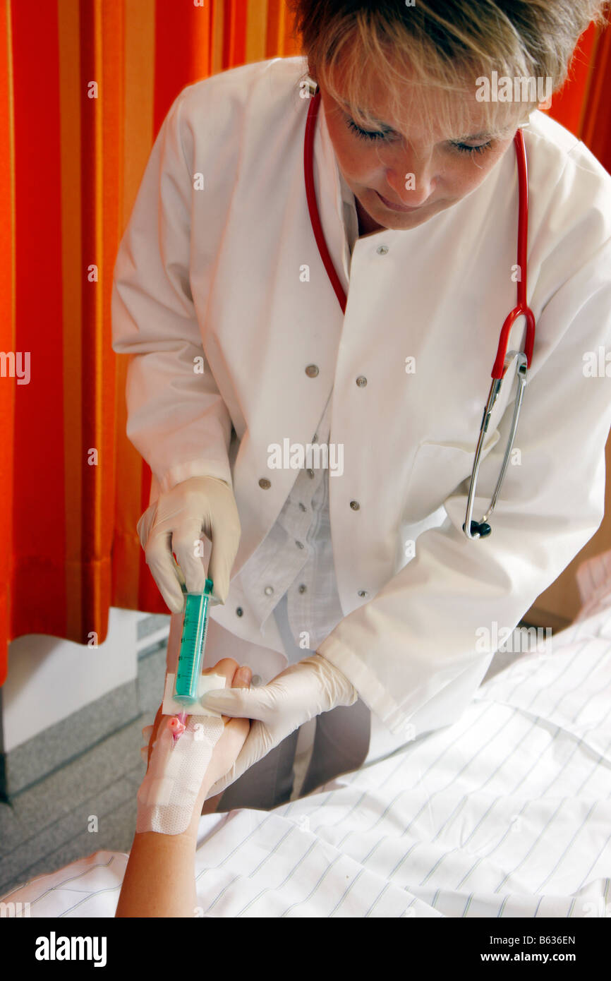 Nurse taking of a blood sample from a patient in a hospital Stock Photo ...