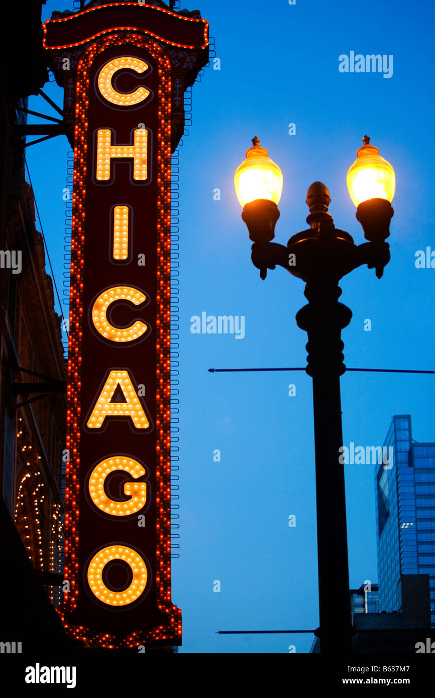 Low angle view of Chicago neon sign lit up at dusk, Chicago Theatre ...