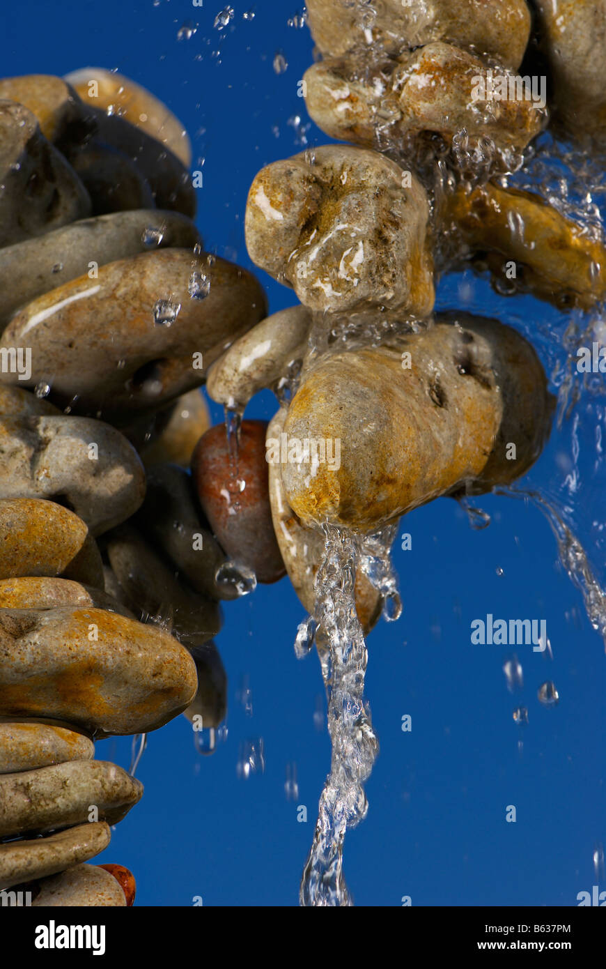 Water dripping from pebbles Stock Photo - Alamy