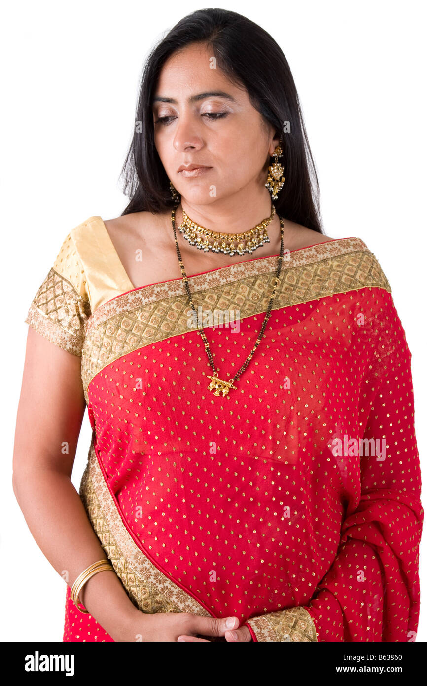 Portrait of an East Indian woman isolated against a white backdrop ...