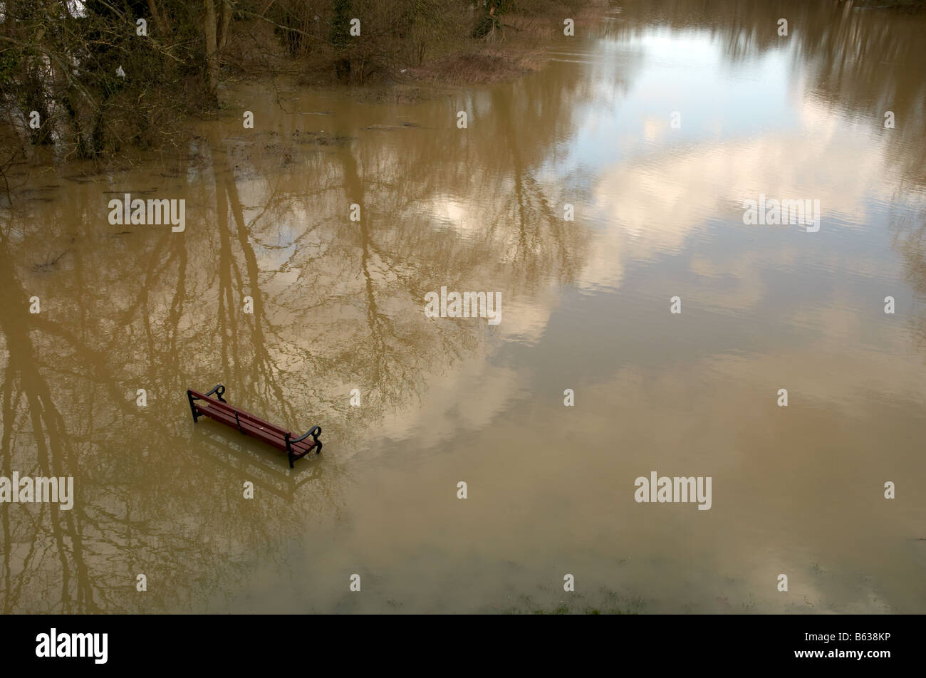 Flooded bench in Angel and Greyhound meadow in Oxford, England Stock ...