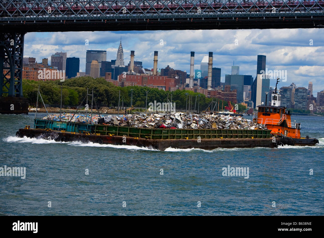 Tugboat carrying garbage in the river, Hudson River, Manhattan, New ...