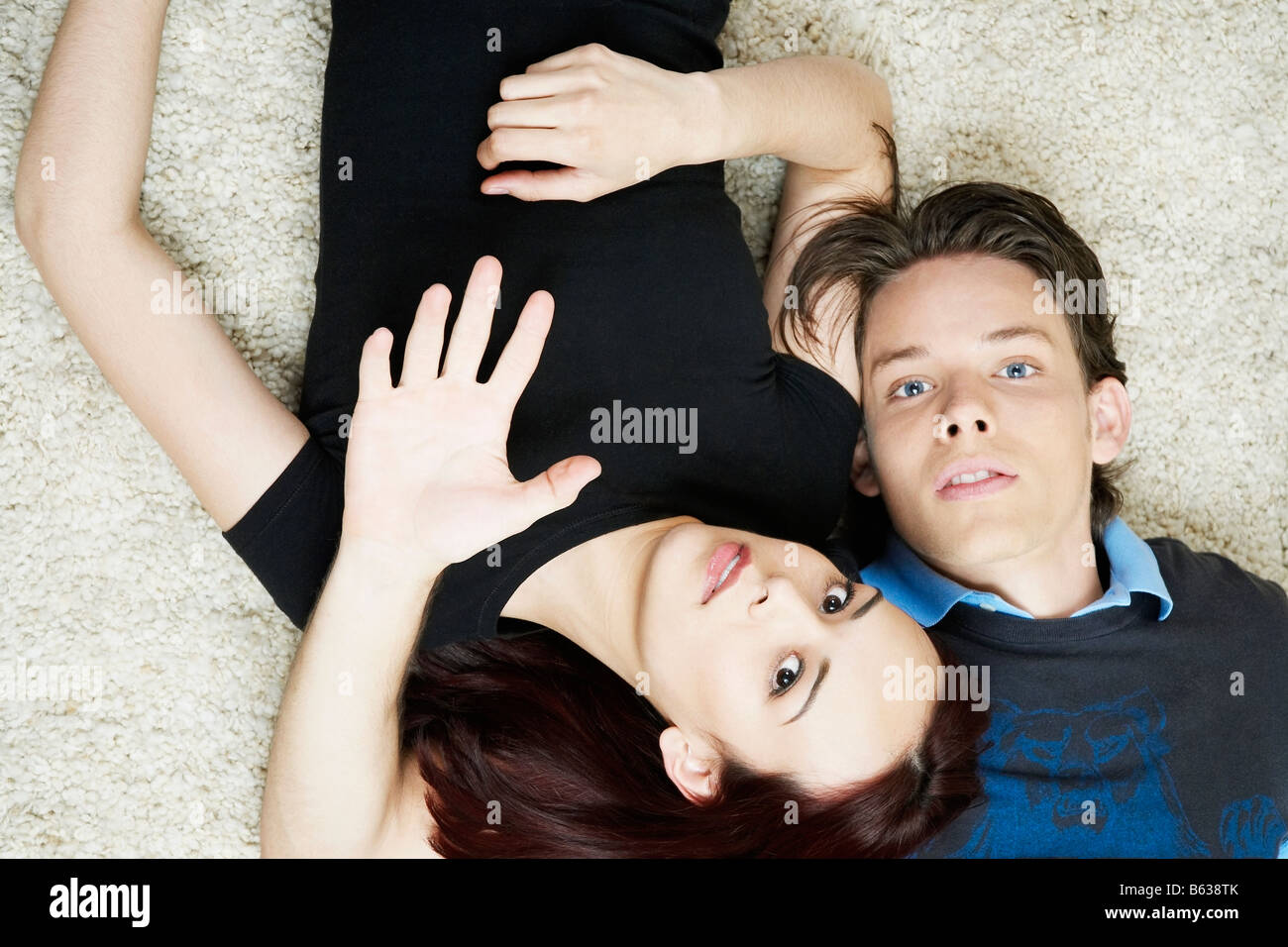 High angle view of a young couple lying on her back Stock Photo - Alamy