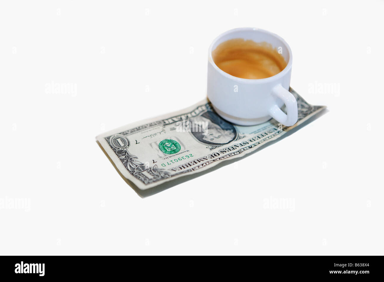 Coffee cup on an American dollar bill Stock Photo - Alamy