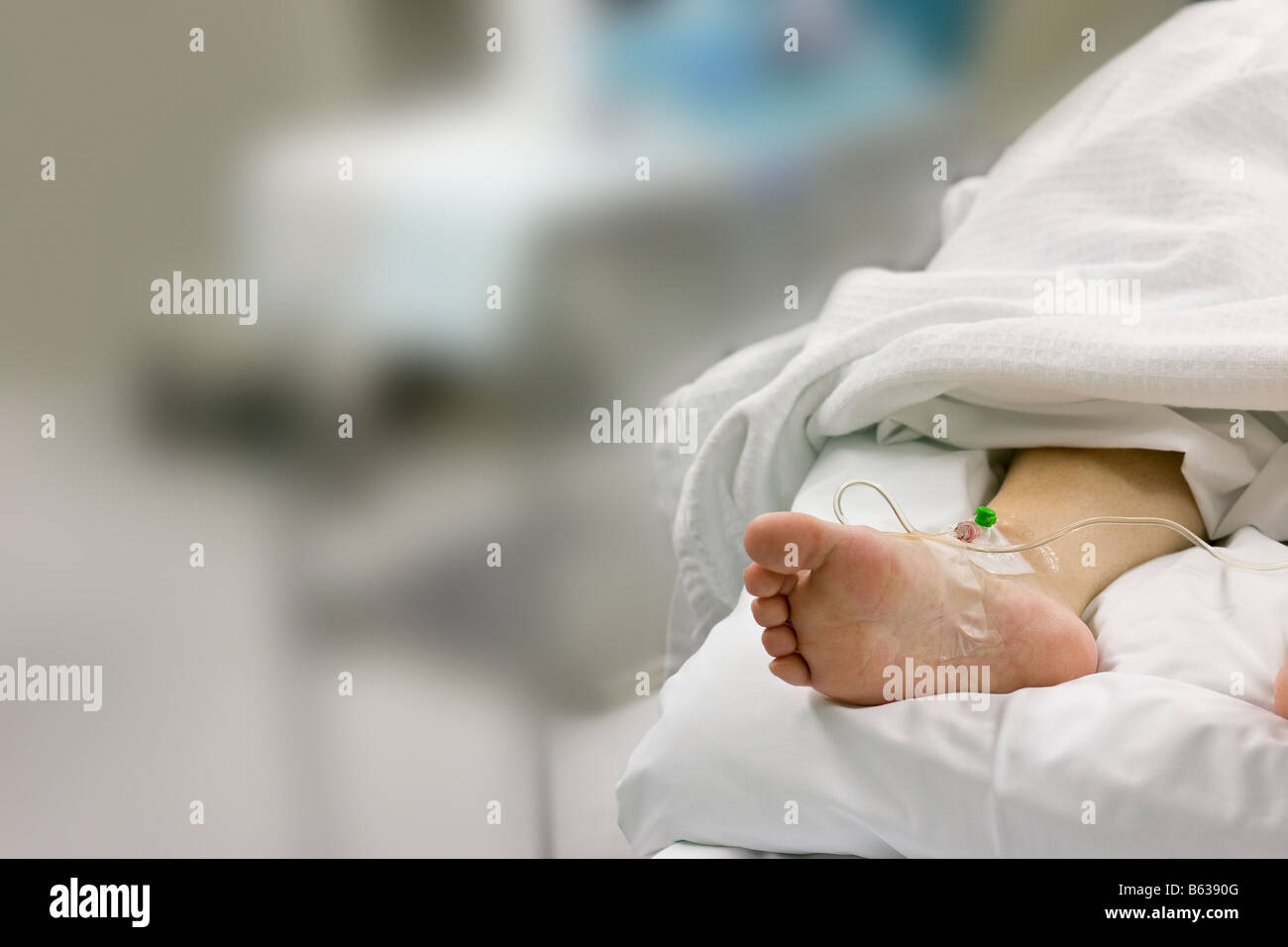 Intravenous drip in foot during brain surgery to remove a benign tumor ...