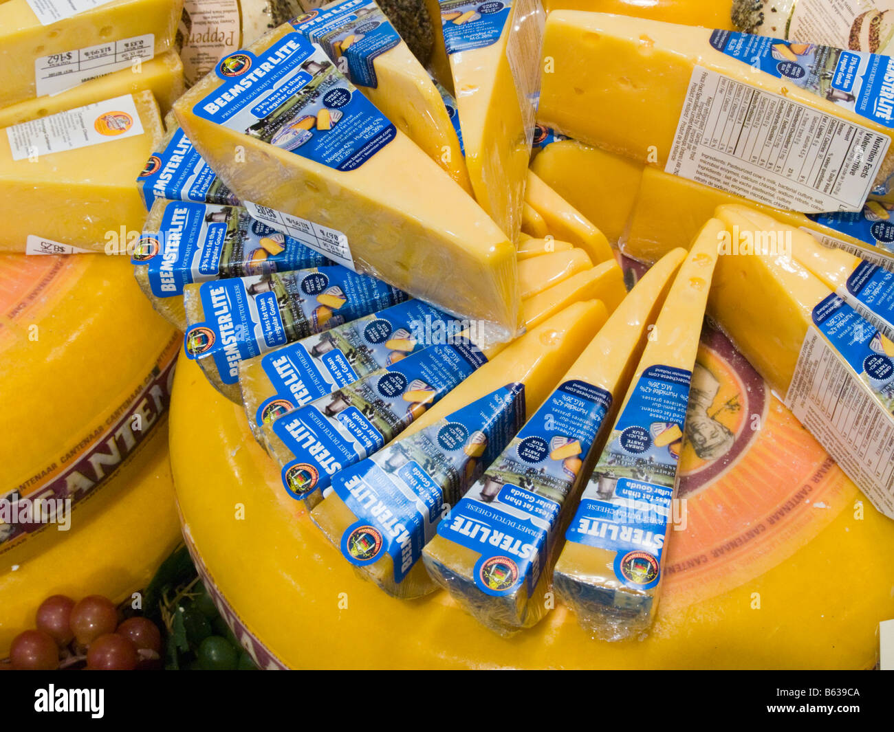Cheese display at a grocery store Stock Photo - Alamy