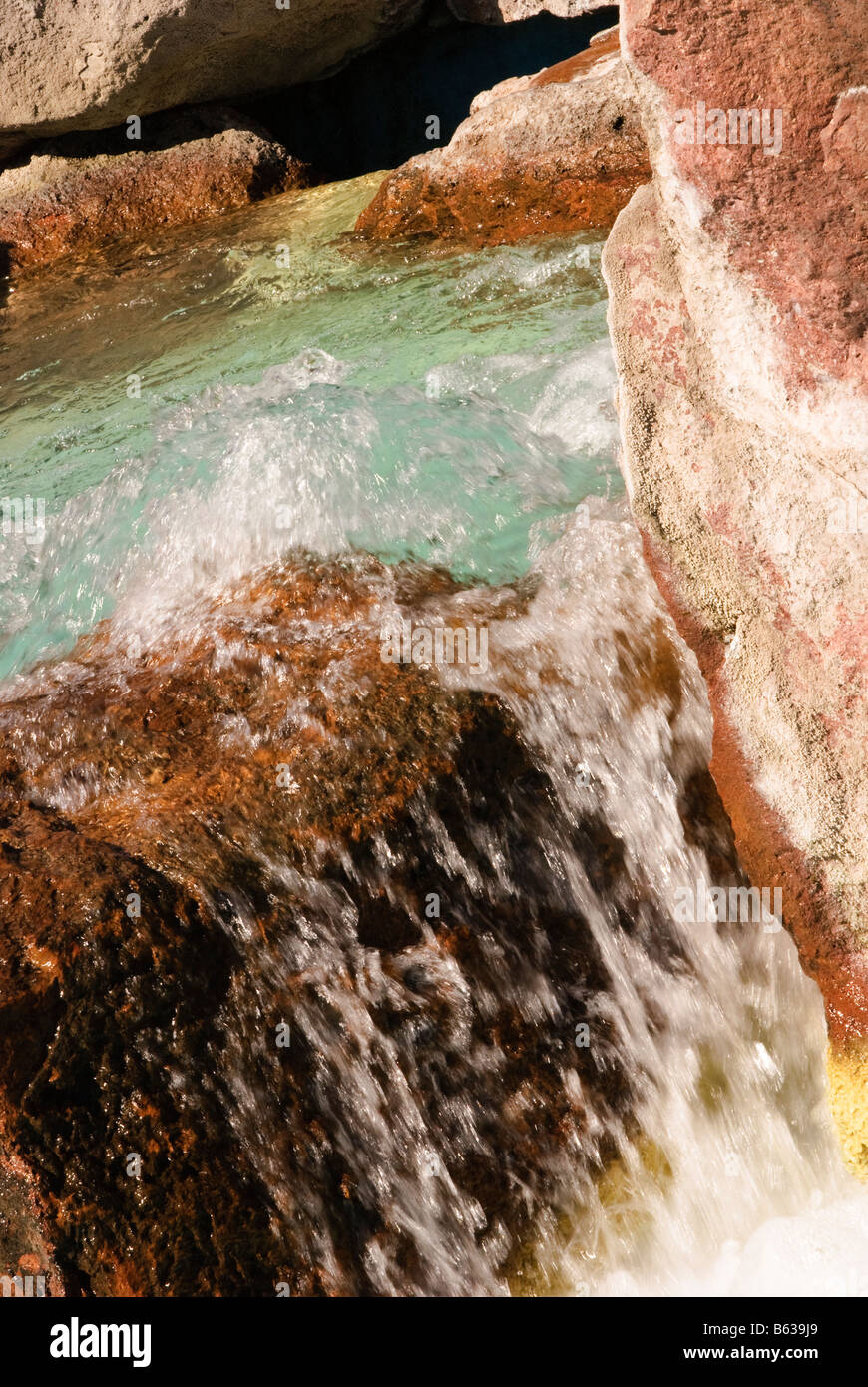 Small rock pool with waterfall Stock Photo - Alamy
