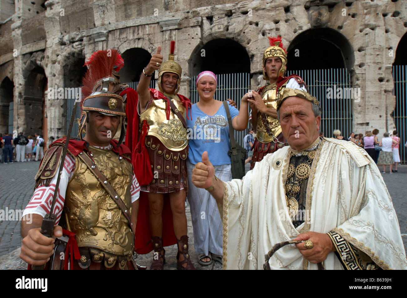 Julius Caesar and Roman centurions meet tourists outside the Colosseum ...