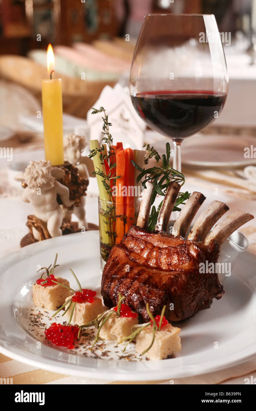 Dinner in restaurant with flaming candle and wine Stock Photo - Alamy