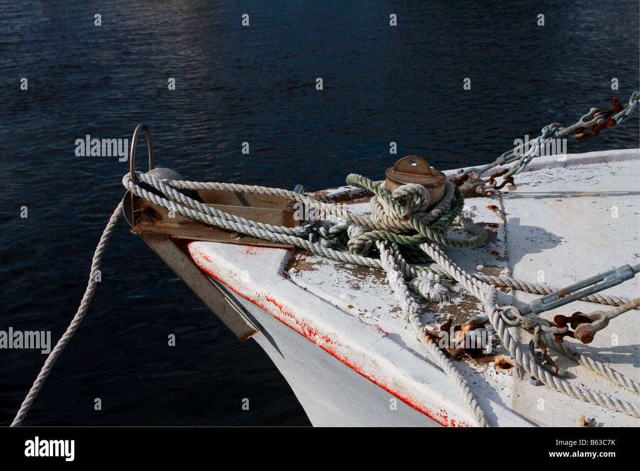 Bow of boat with rigging with water in background Stock Photo - Alamy