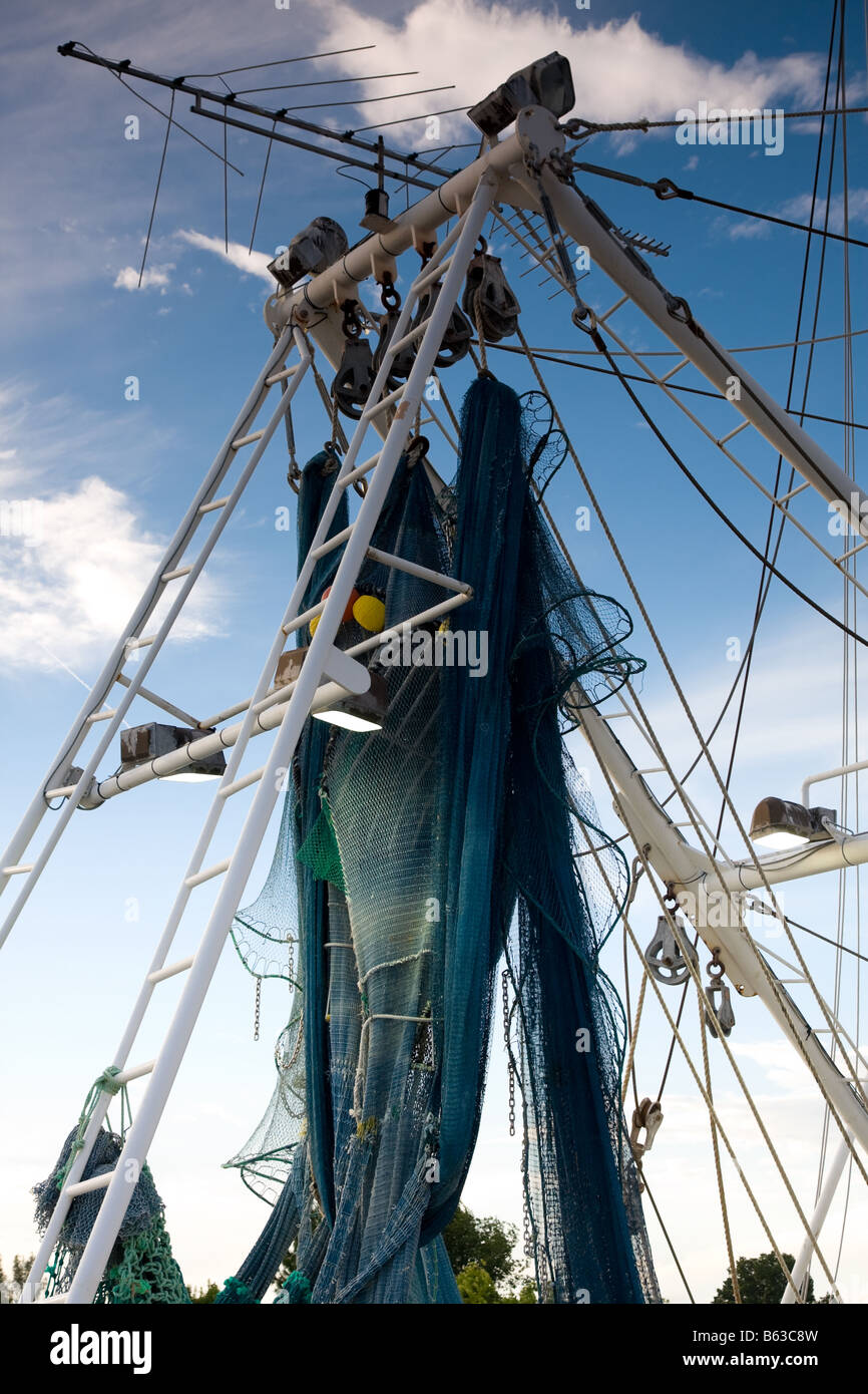 Fishing boat nets hanging from the rigging Stock Photo - Alamy