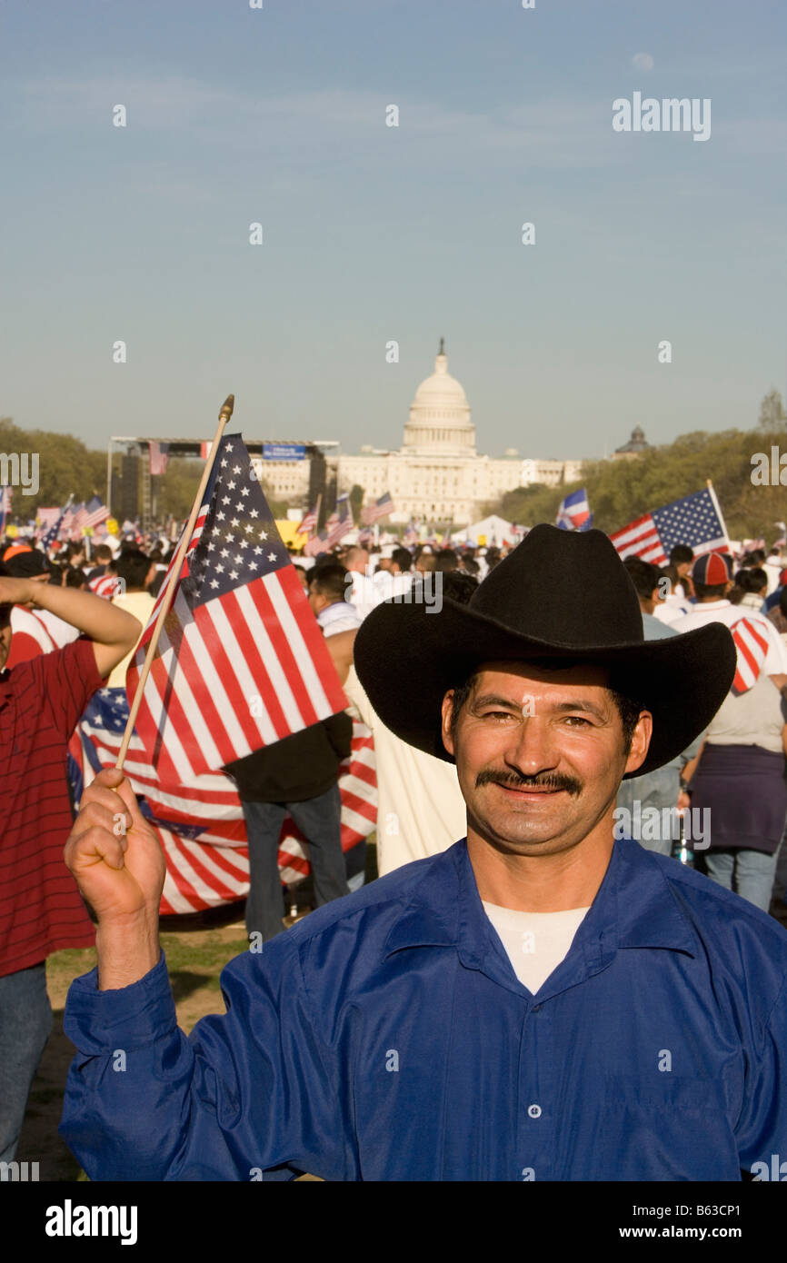 Portrait of a mid adult man holding an American flag and smiling ...