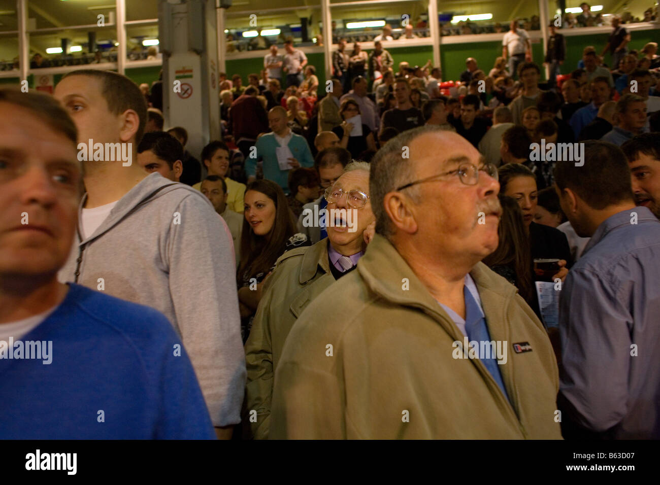 A crowd watch the greyhounds race at Walthamstow stadium Stock Photo ...