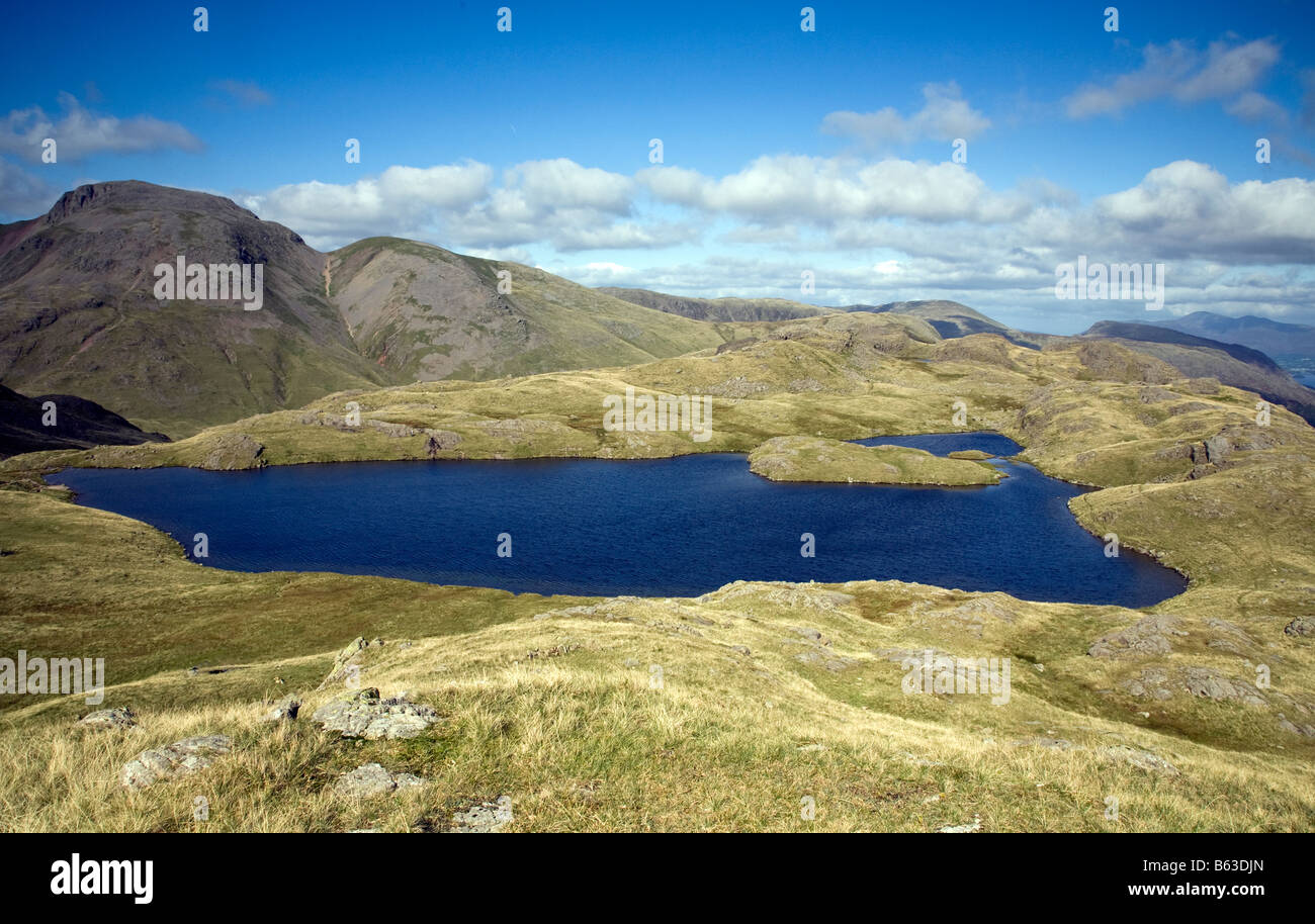 "Seathwaite Fell" and the deep blue waters of "Sprinkling Tarn Stock ...