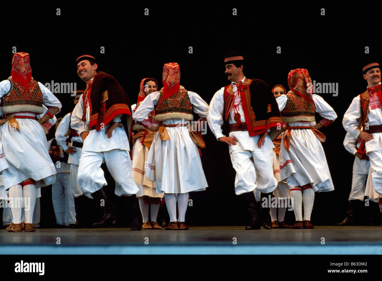 A Croatian Folk Dance Group performing on Stage in Traditional Costume ...